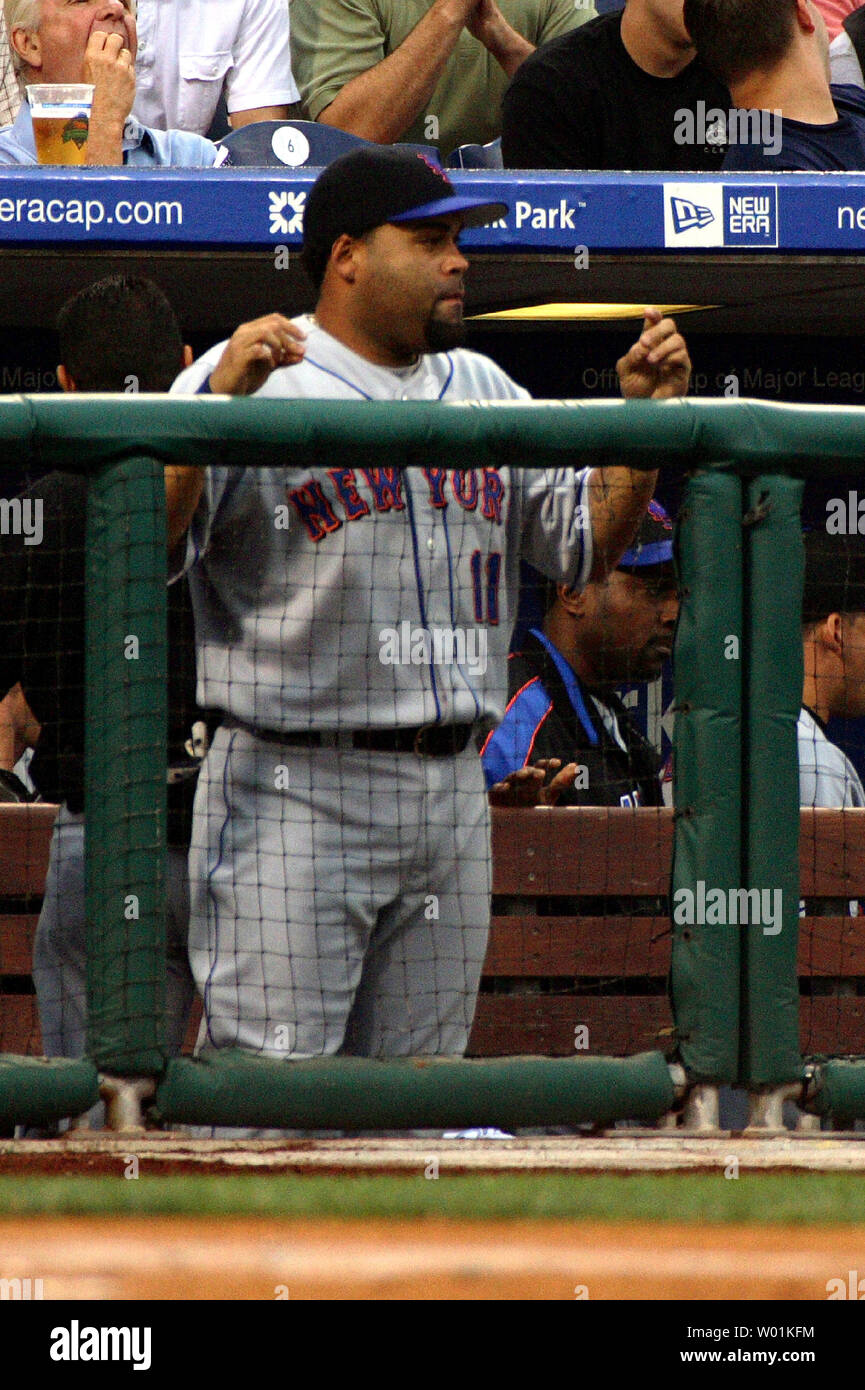 New York's Ramon Castro (#11) snaps his fingers as he watches from the ...