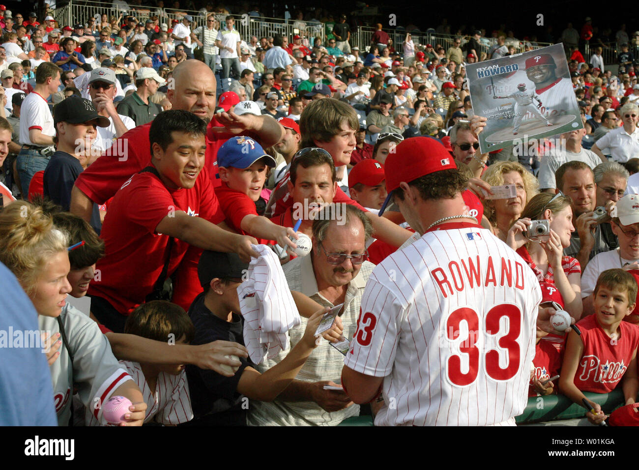 Philadelphia's Aaron Rowland is besieged by autograph seekers prior to ...