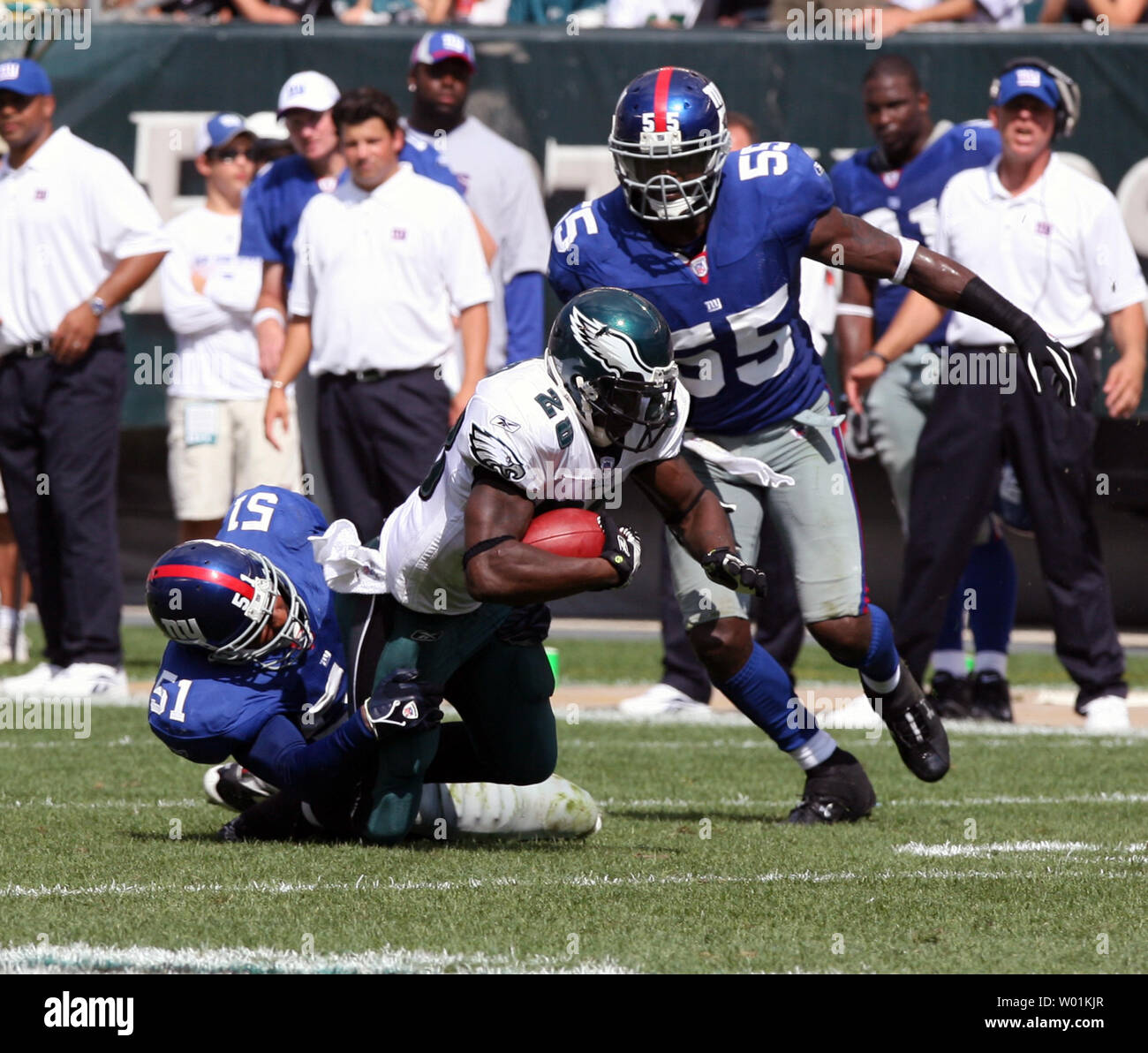 New York's Carlos Emmons (#51) brings Philadelphia's Correll Buckhalter ...