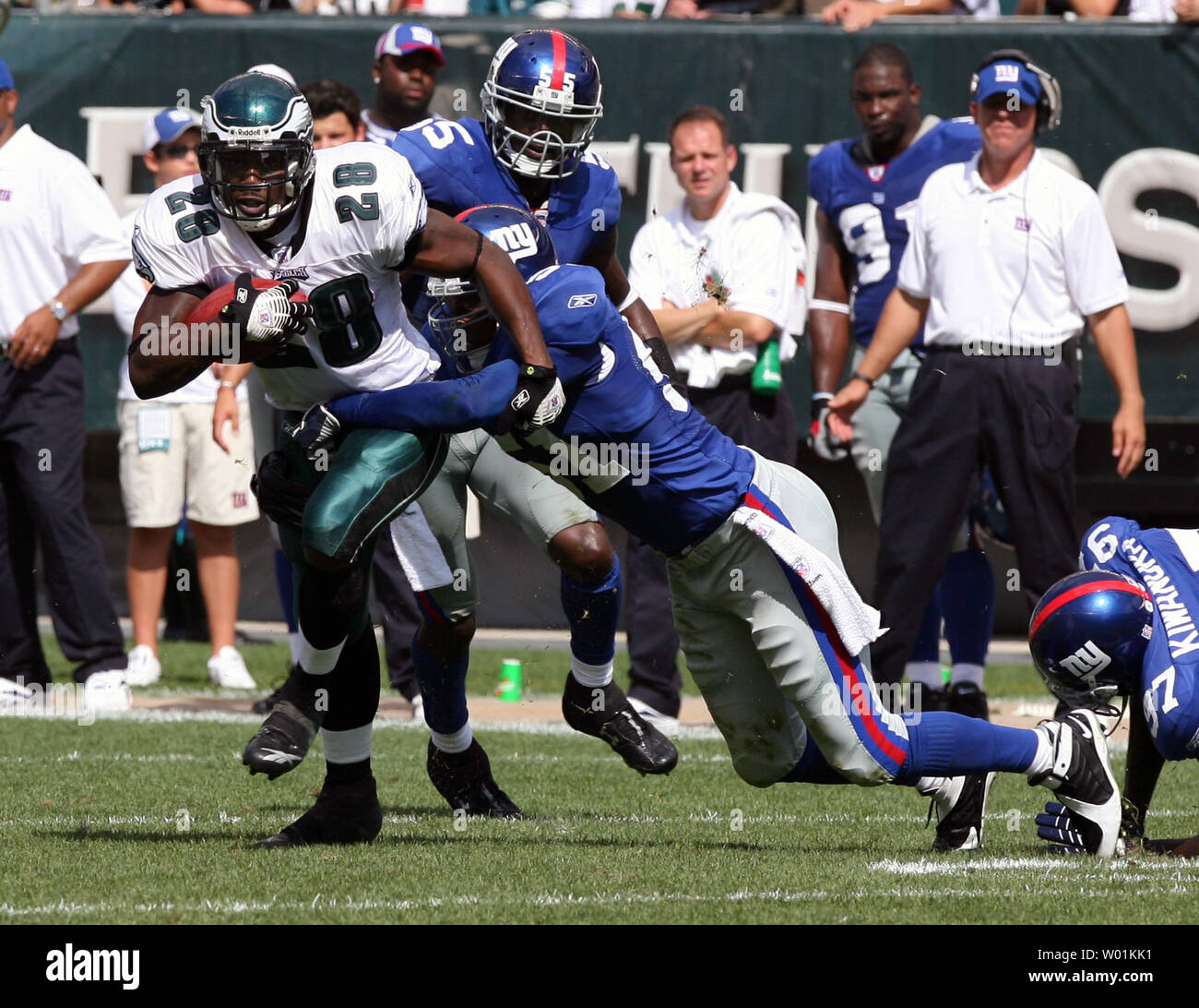 New York's Carlos Emmons (#51) brings Philadelphia's Correll Buckhalter ...