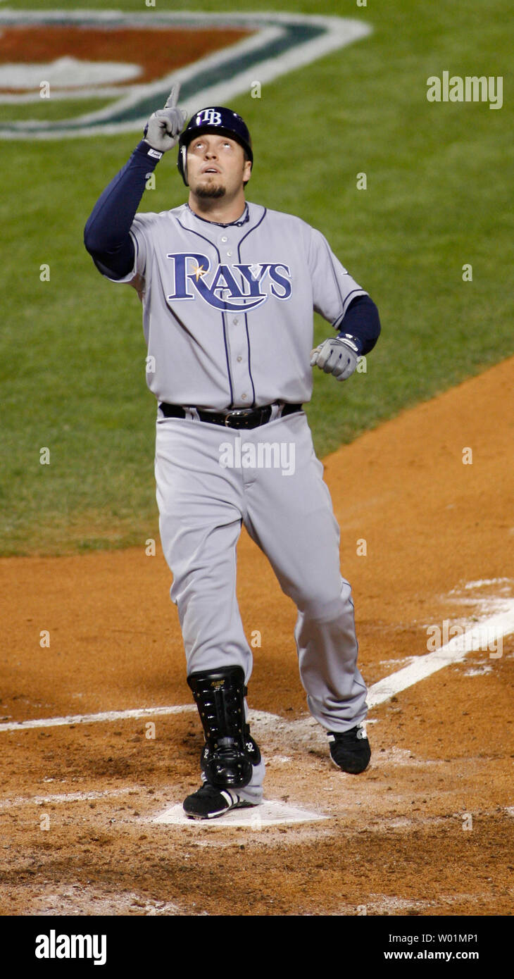 Tampa Bay Rays Eric Hinske gives a blessing as he crosses home plate ...