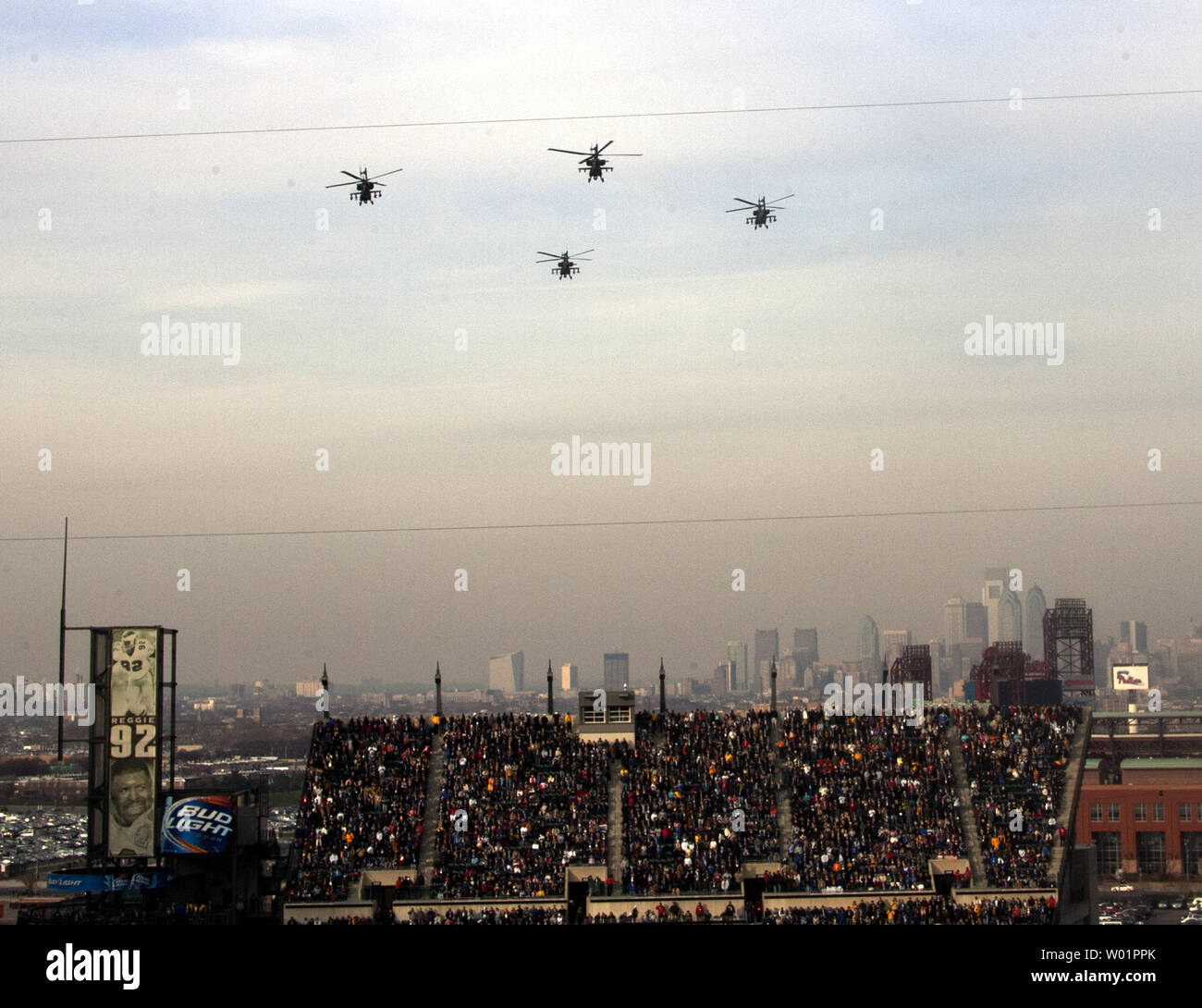 Four Apache helicopters do a fly over of the stadium with the ...