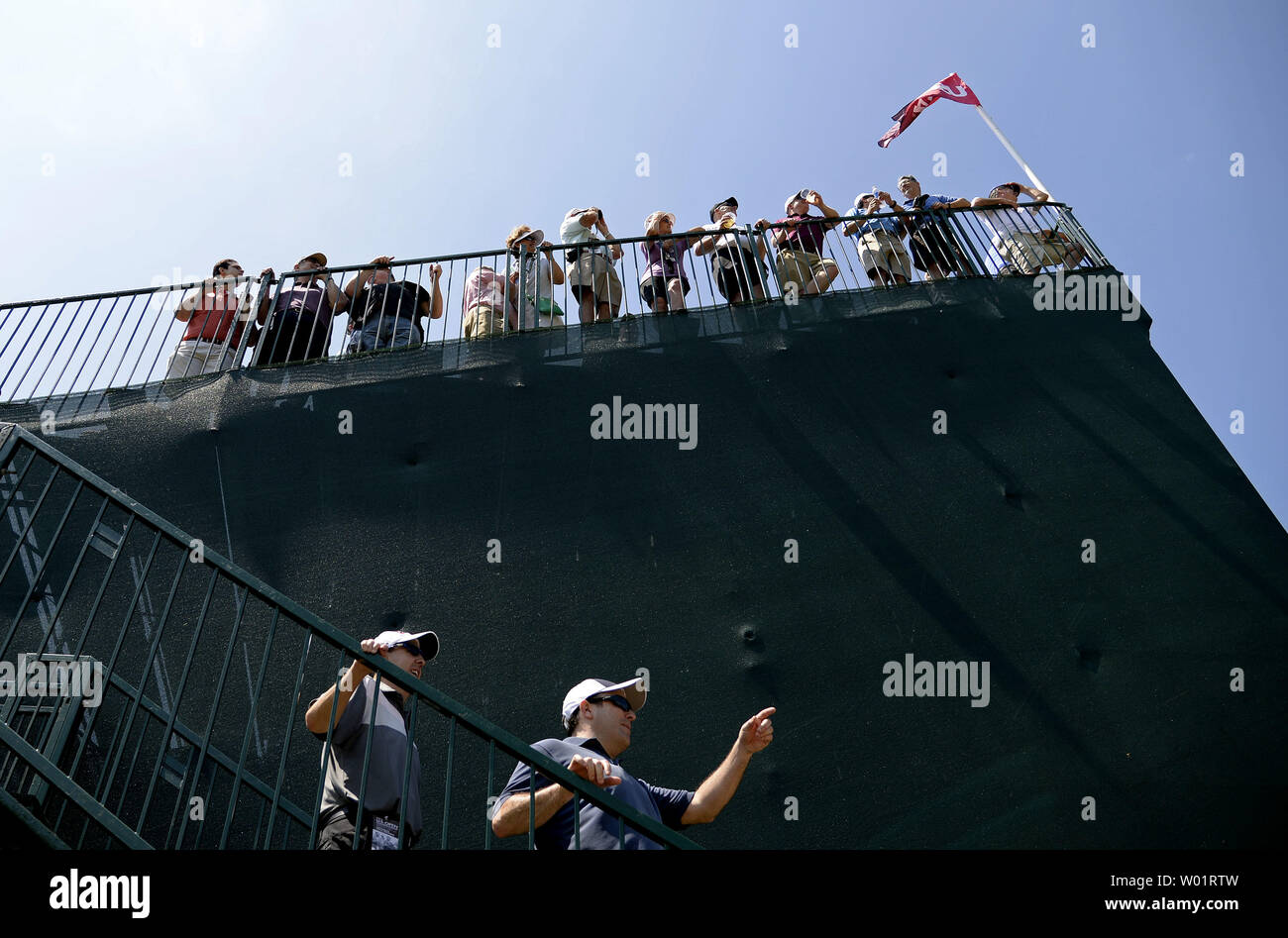 Golf fans watch a practice round prior to the 113th U.S. Open ...
