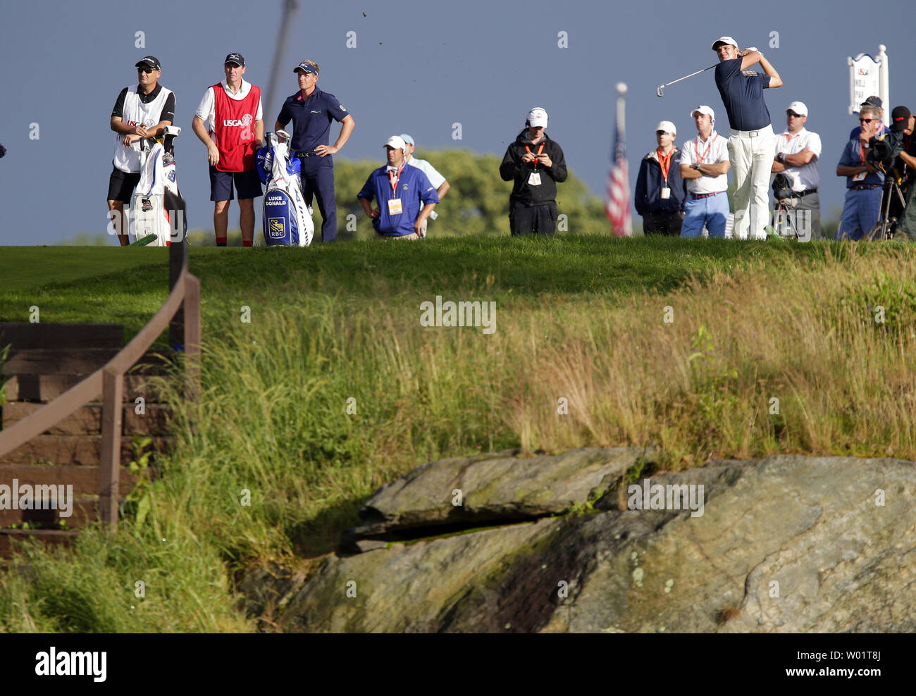 Justin Rose hits a tee shot on the 17th hole in the final round at the ...