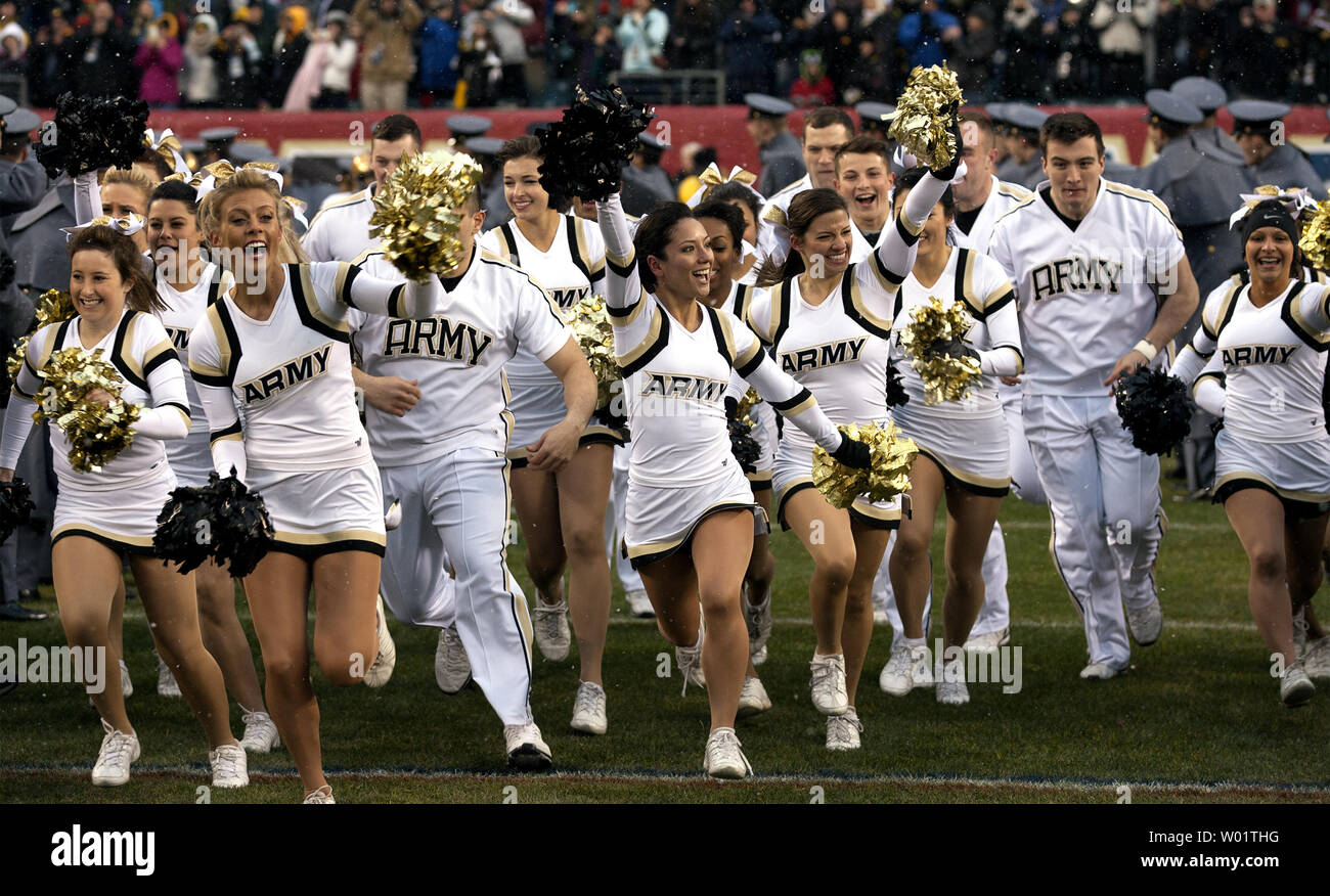 Navy Cheer squad leads the charge at the start of the 114th Annual Army ...