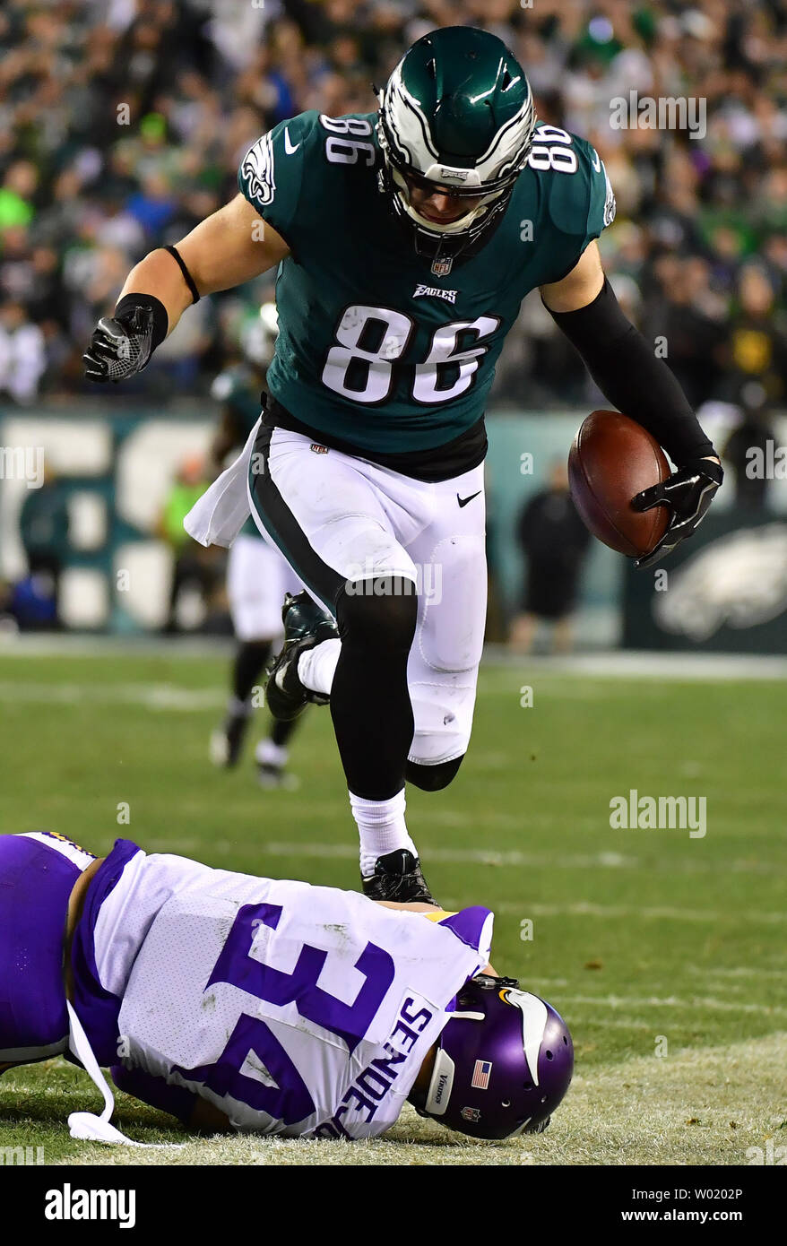 Philadelphia Eagles Zach Ertz (86) leaps over Minnesota Vikings Andrew ...