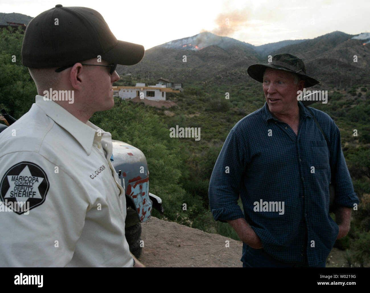 Ed Voss (right) tells Sheriff's Posse C.L. Calhoun that he will not ...