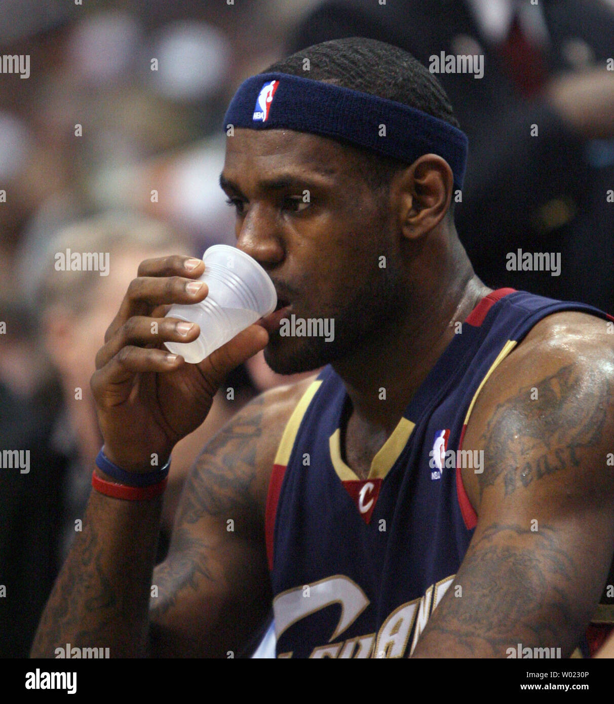 Cleveland Cavaliers forward LeBron James takes a drink during a time ...