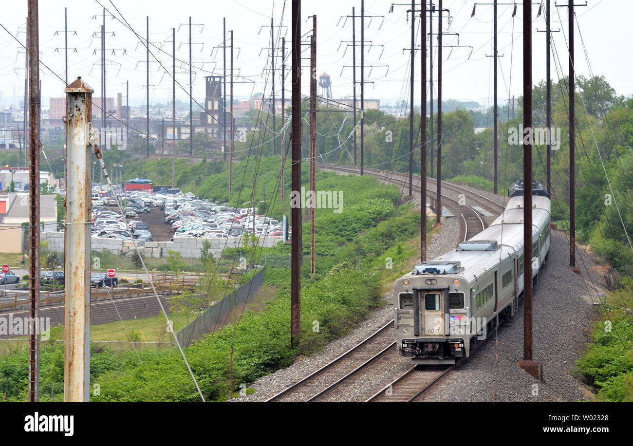A New Jersey Transit computer train travels near the site of last week ...