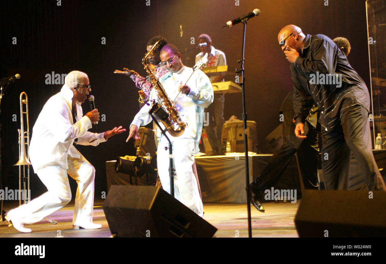 Dennis "DT" Thomas (left) leads "Kool and the Gang" in concert ...