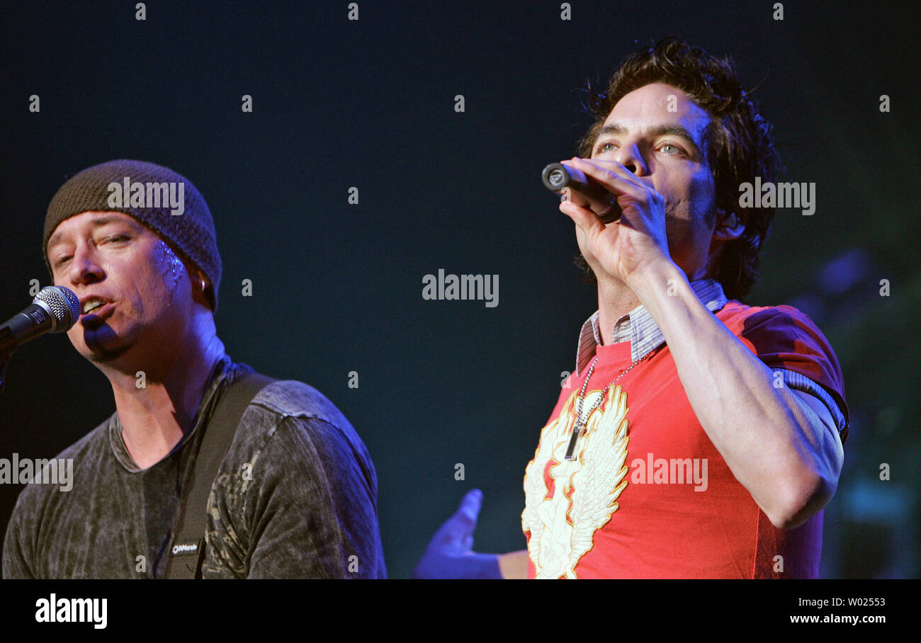 Jimmy Stafford (L) and Pat Monahan of the rock group Train appear in ...