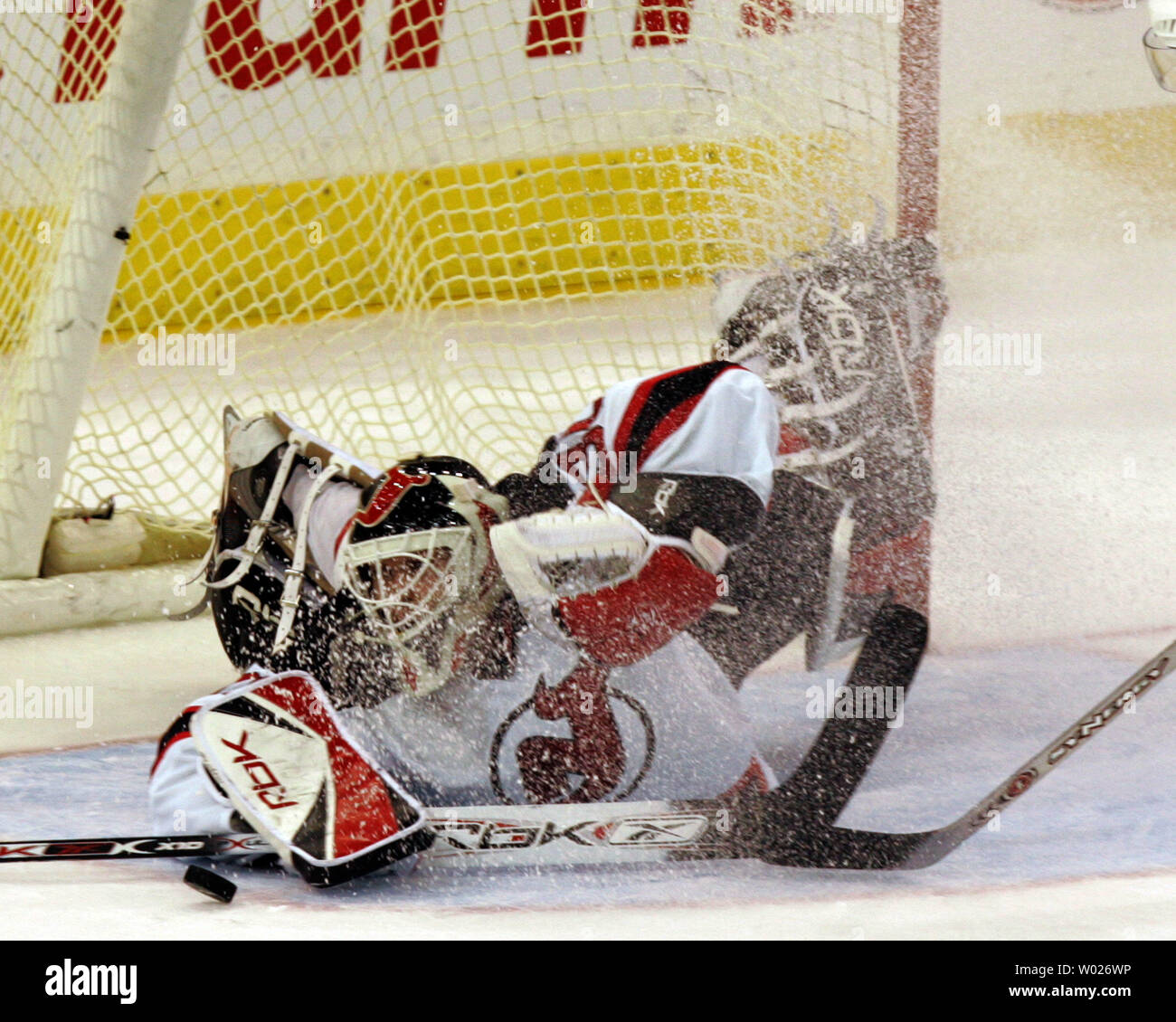 New Jersey Devils Martin Brodeur blocks a shot by Pittsburgh Penguins ...