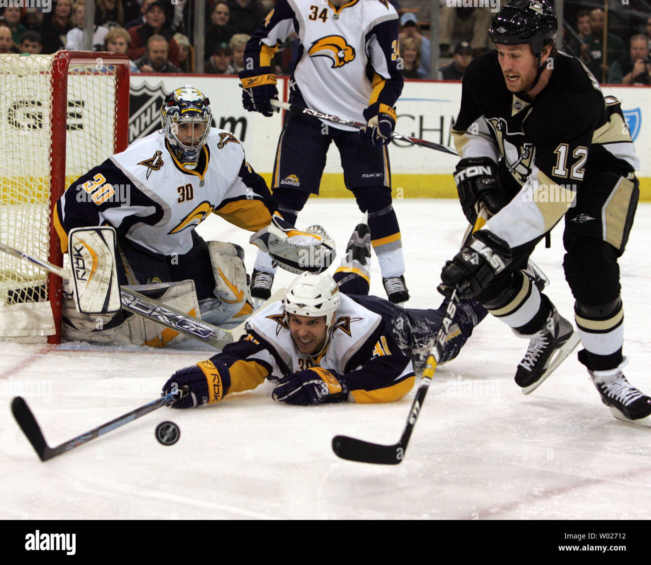 Pittsburgh Penguins Ryan Malone (R) fights with Buffalo Sabres Nathan ...
