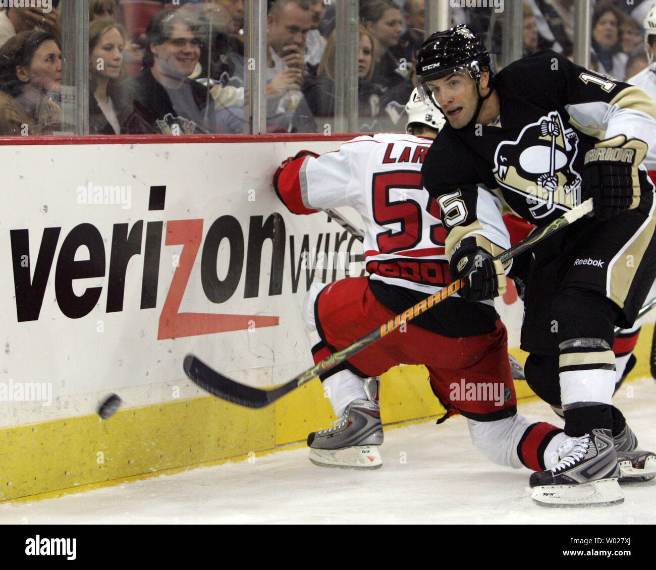 Pittsburgh Penguins Mike Zigomanis steals the puck from Carolina ...
