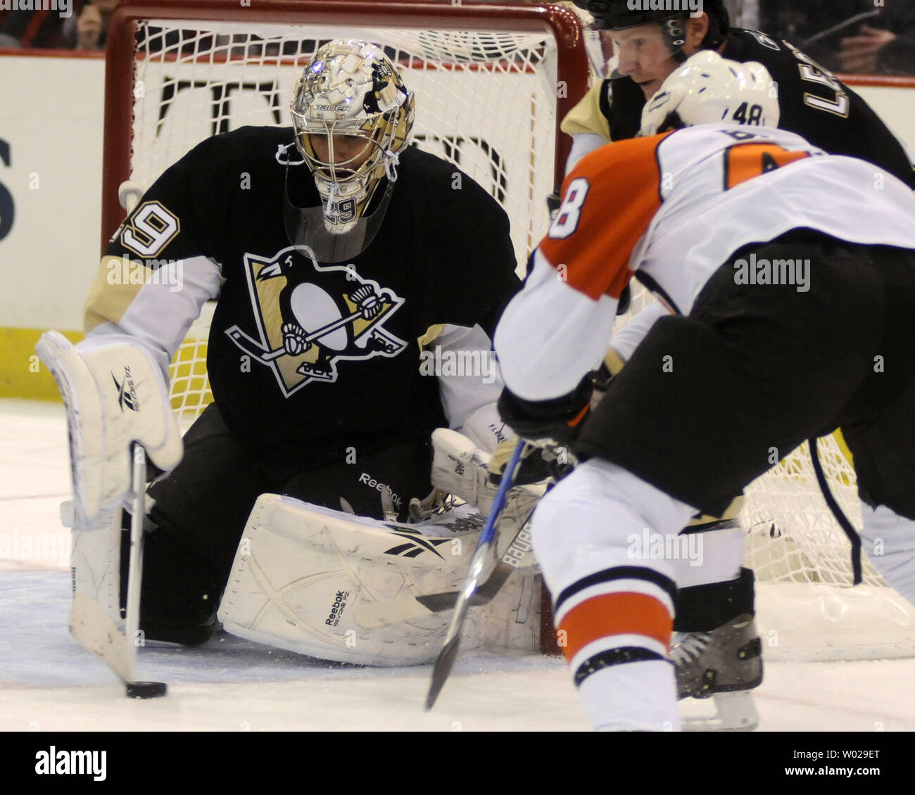 Pittsburgh Penguins goalie Marc-Andre Fleury pulls in the puck ...