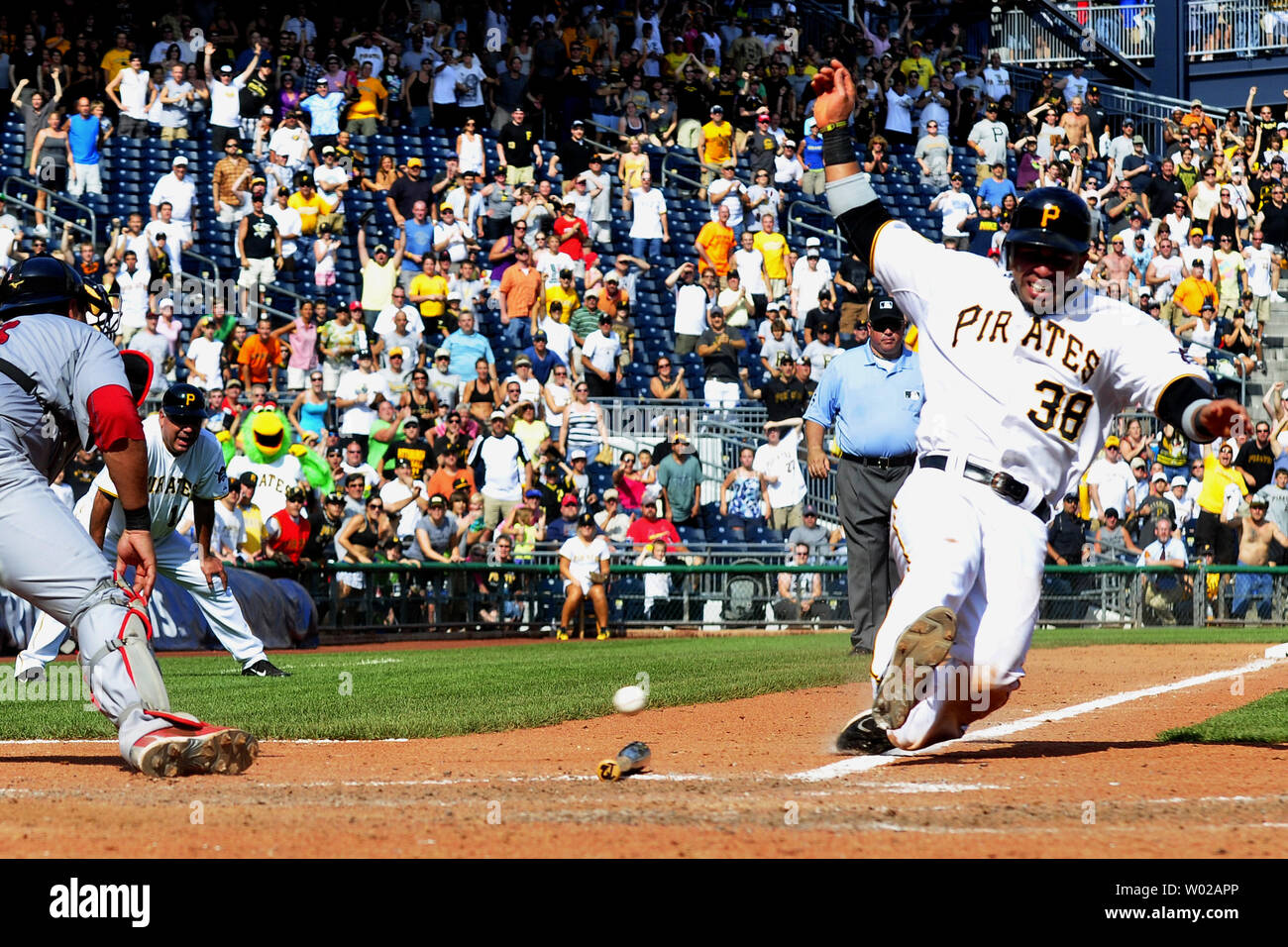 Pittsburgh Pirates Xavier Paul slides into home scoring the winning run ...