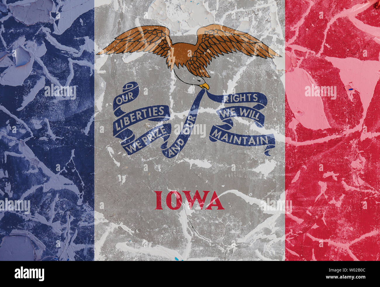 The national flag of the US state Iowa in against a gray wall with ...