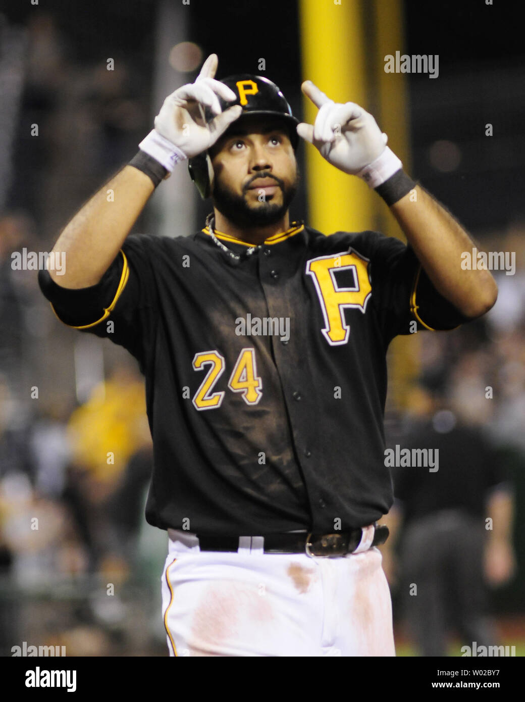 Pittsburgh Pirates Pedro Alvarez points to the sky following his second ...