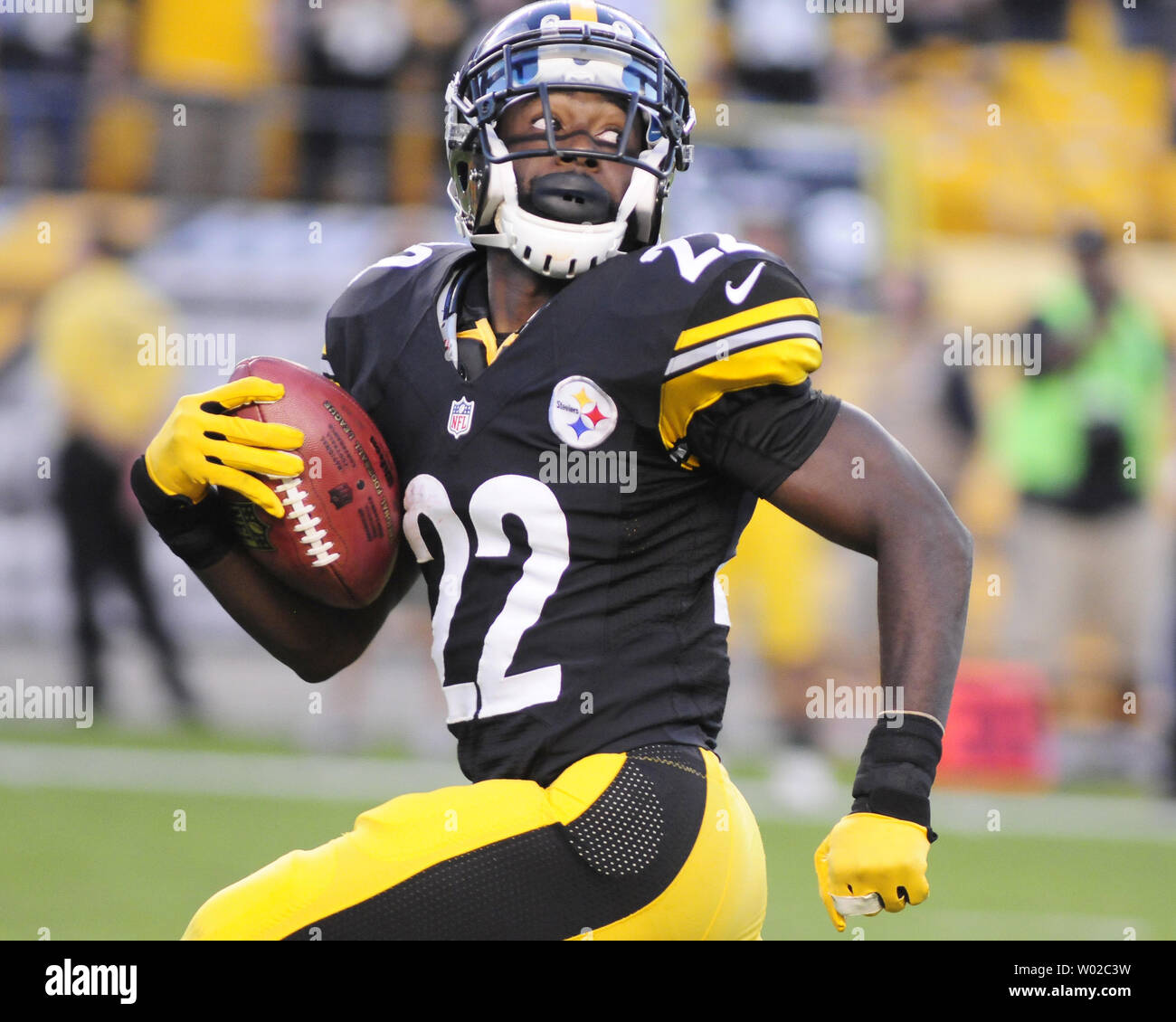 Pittsburgh Steelers Chris Rainey looks over his shoulder as he returns ...