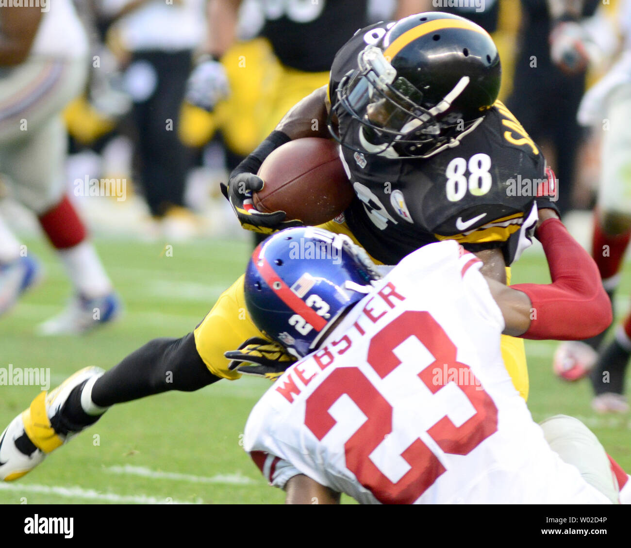 New York Giants cornerback Corey Webster (23) pulls down Pittsburgh ...