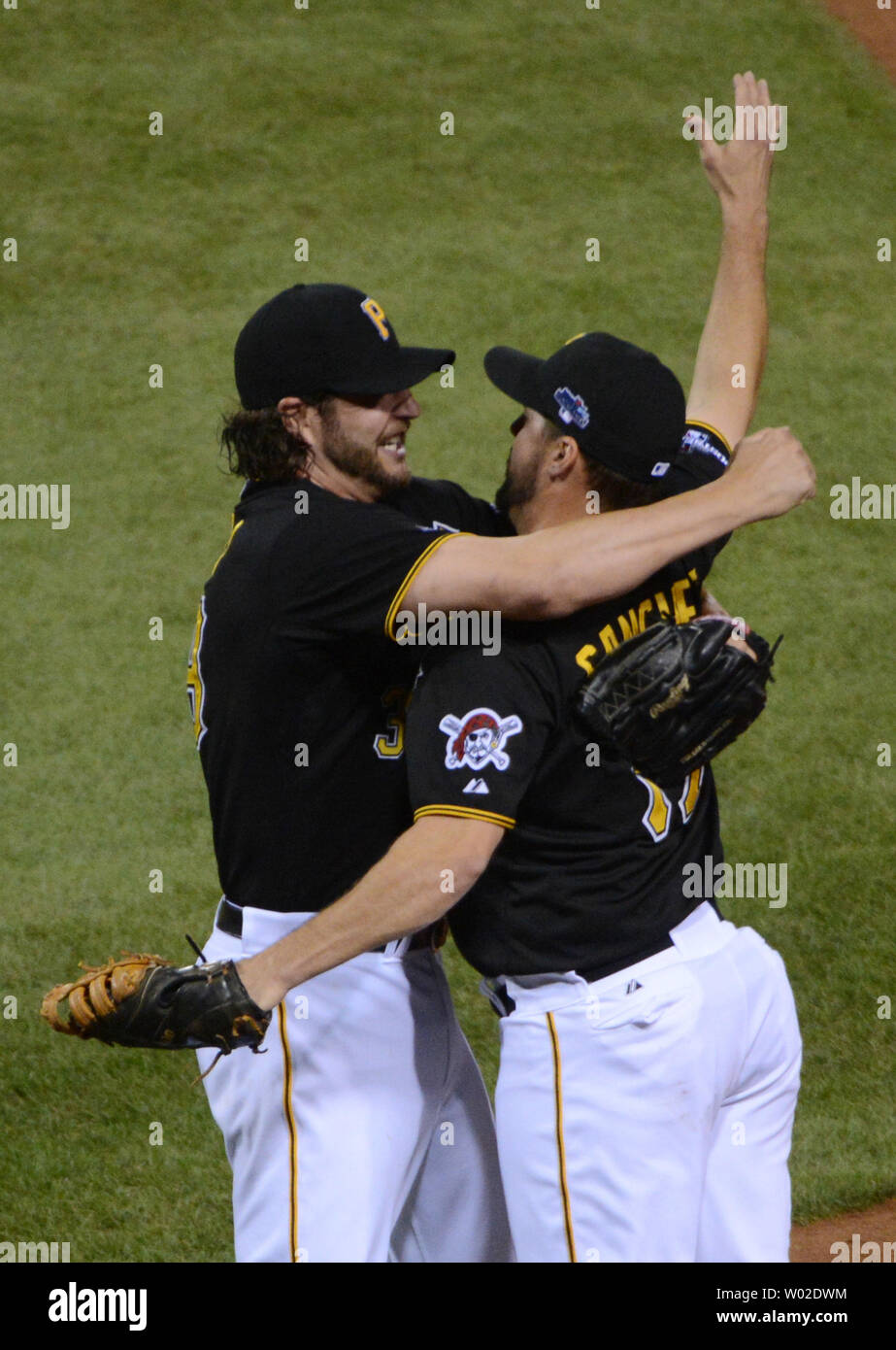 Pittsburgh Pirates closer Jason Grilli hugs first baseman Gaby Sanchez ...