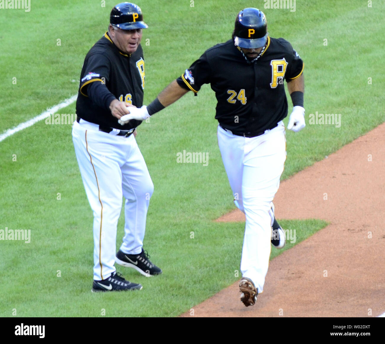 Pittsburgh Pirates third base coach Nick Leyva (16) congradulates ...