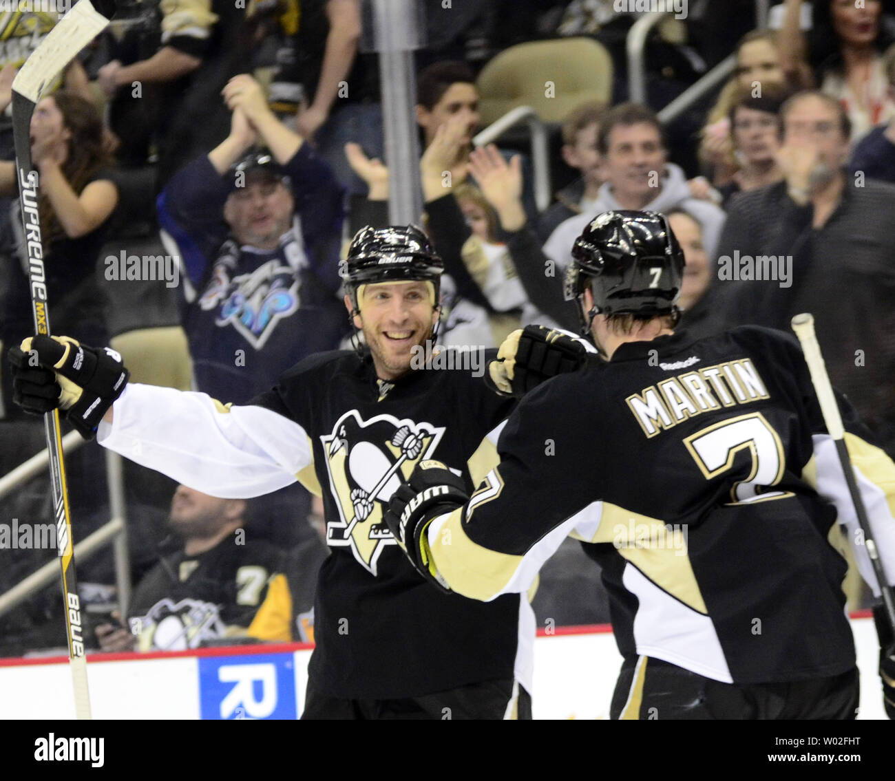 Pittsburgh Penguins defenseman Rob Scuderi (4) celebrates his goal with ...