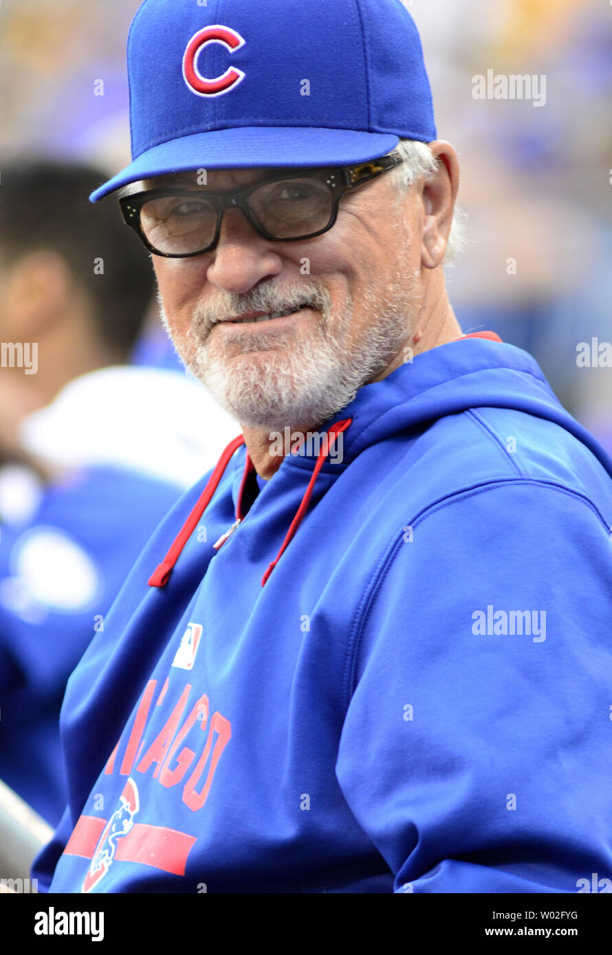 Chicago Cubs manager Joe Maddon (70) smiles as he looks out of the ...