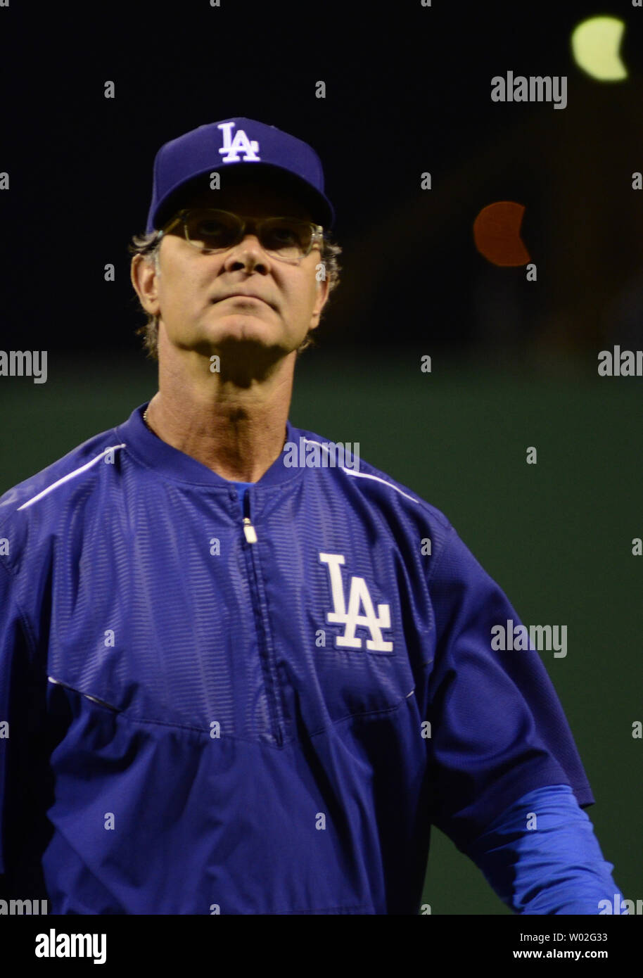 Los Angeles Dodgers manager Don Mattingly (8) walks off the field after ...