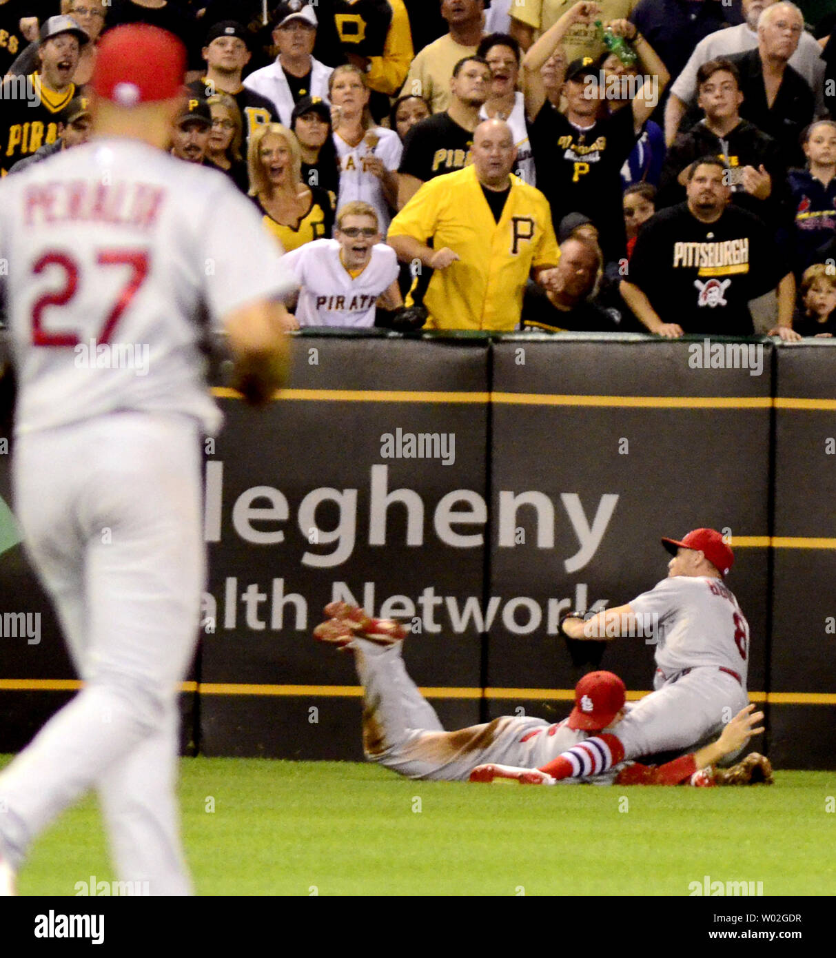 St. Louis Cardinals left fielder Stephen Piscotty (55) collides with St ...