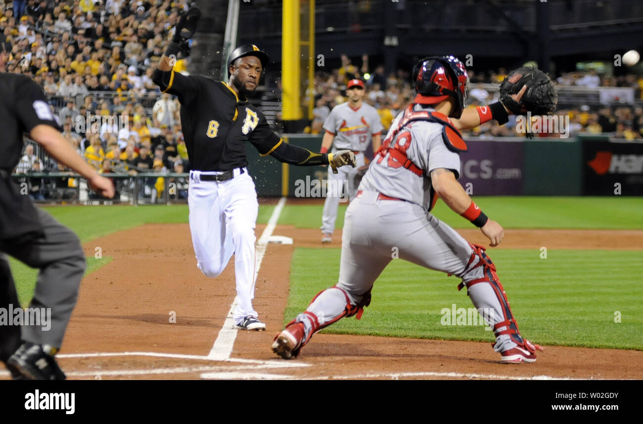 Pittsburgh Pirates left fielder Starling Marte (6) is out at home as St ...