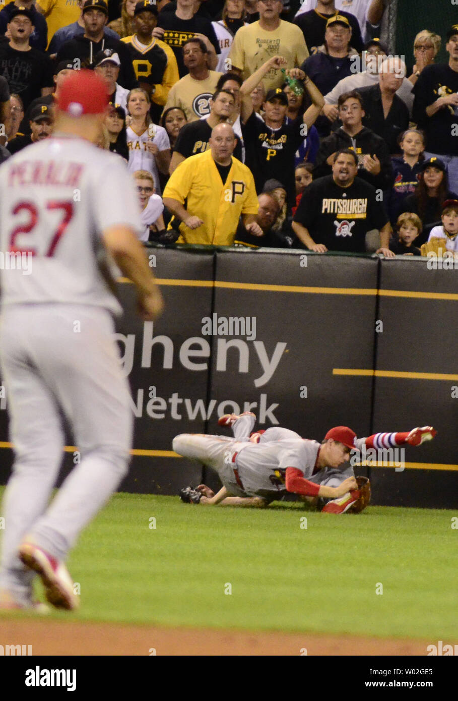 St. Louis Cardinals left fielder Stephen Piscotty (55) collides with St ...