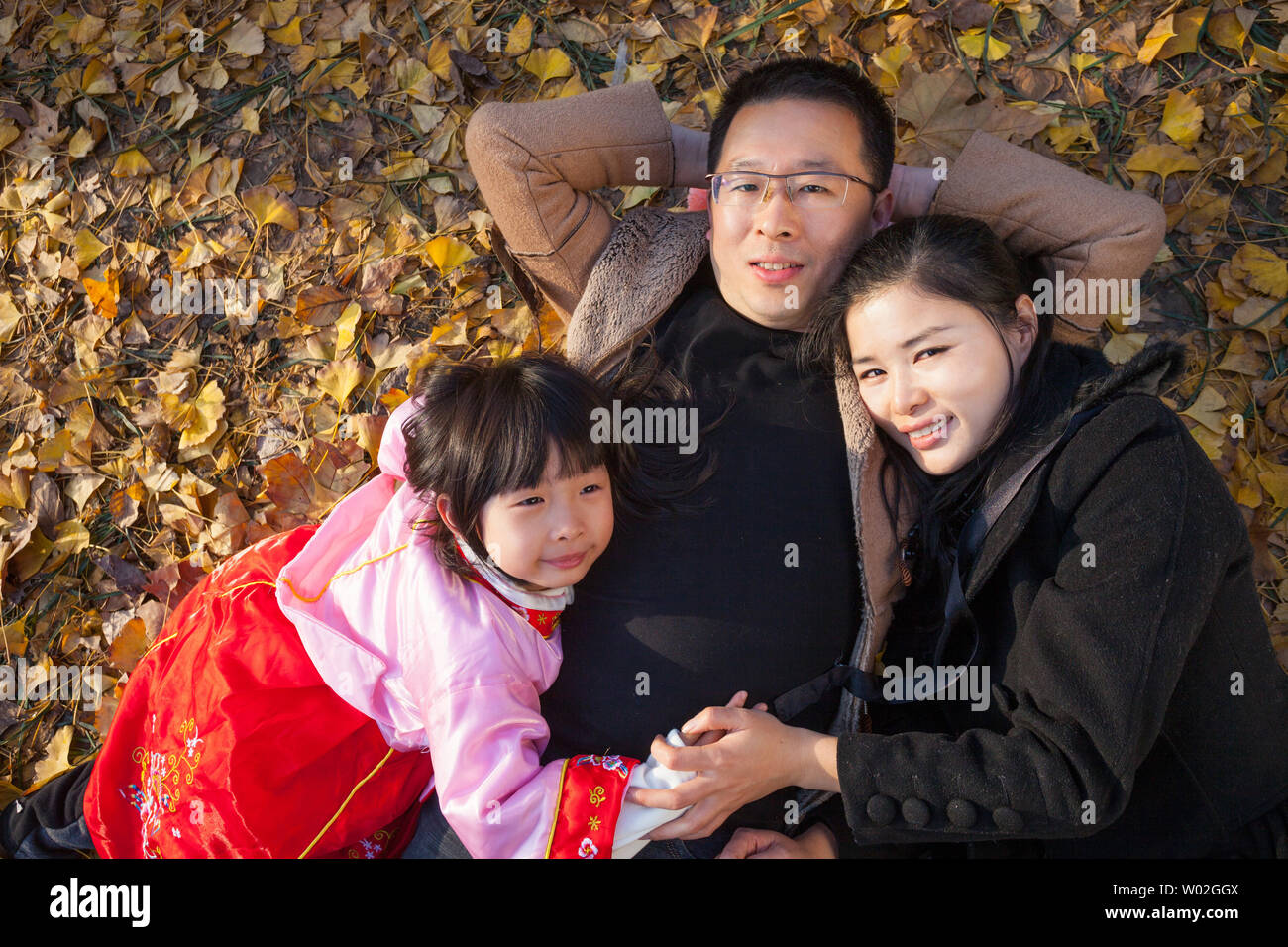 happy family togetherness portrait in forest, father,mother and Stock ...