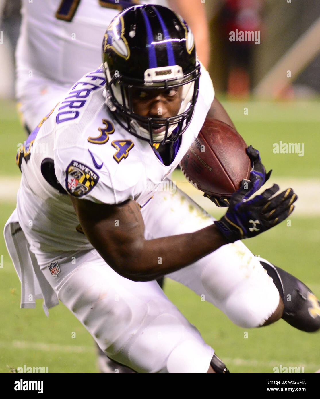 Baltimore Ravens running back Lorenzo Taliaferro (34) gains 11 yards in ...
