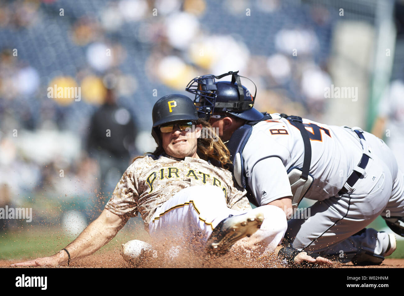 Pittsburgh Pirates first baseman John Jaso (28) slides into home plate ...