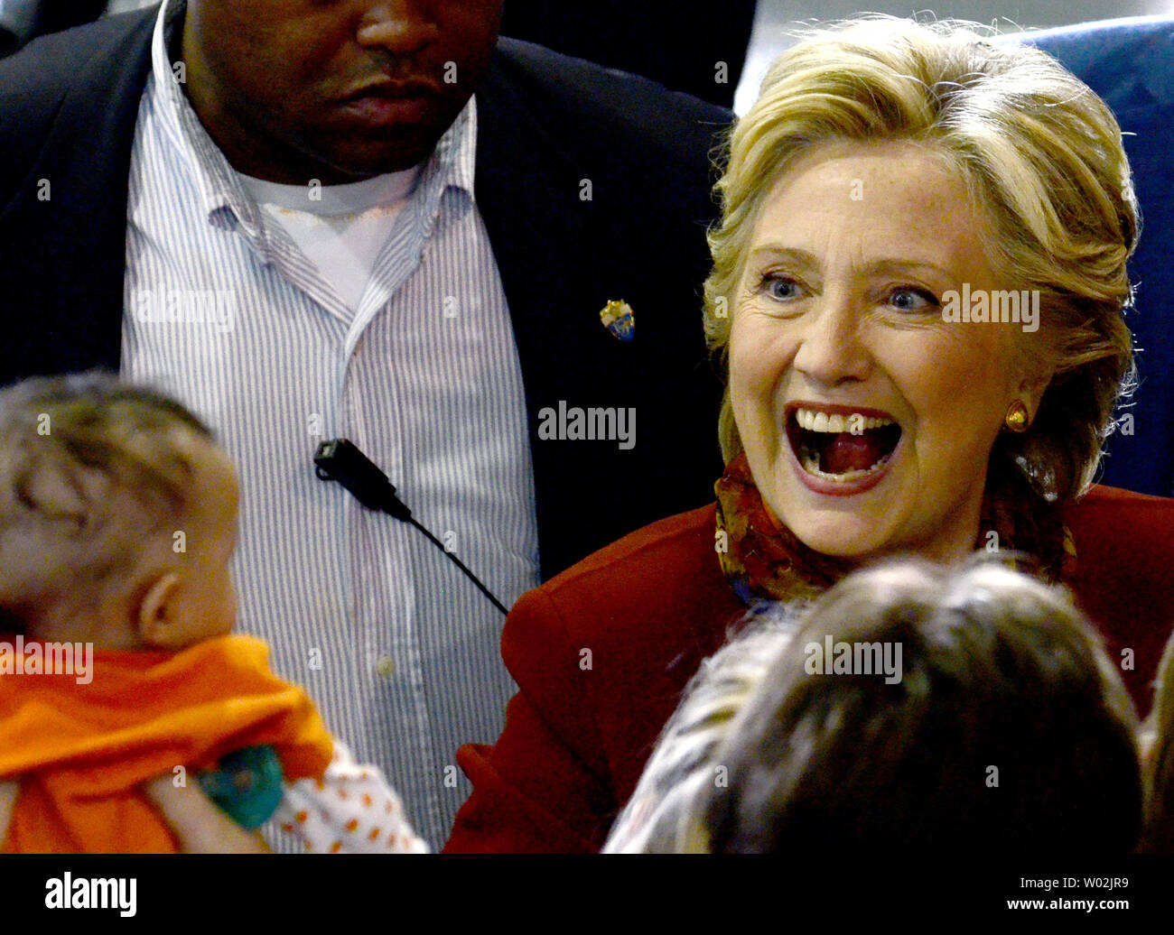 Democratic presidential candidate Hillary Clinton smiles at a baby as ...
