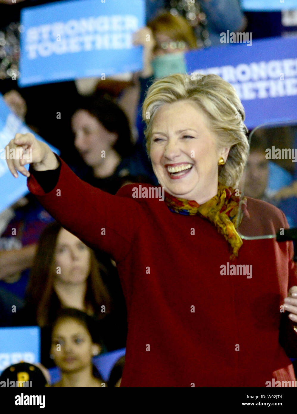 Democratic presidential candidate Hillary Clinton points to the crowd ...