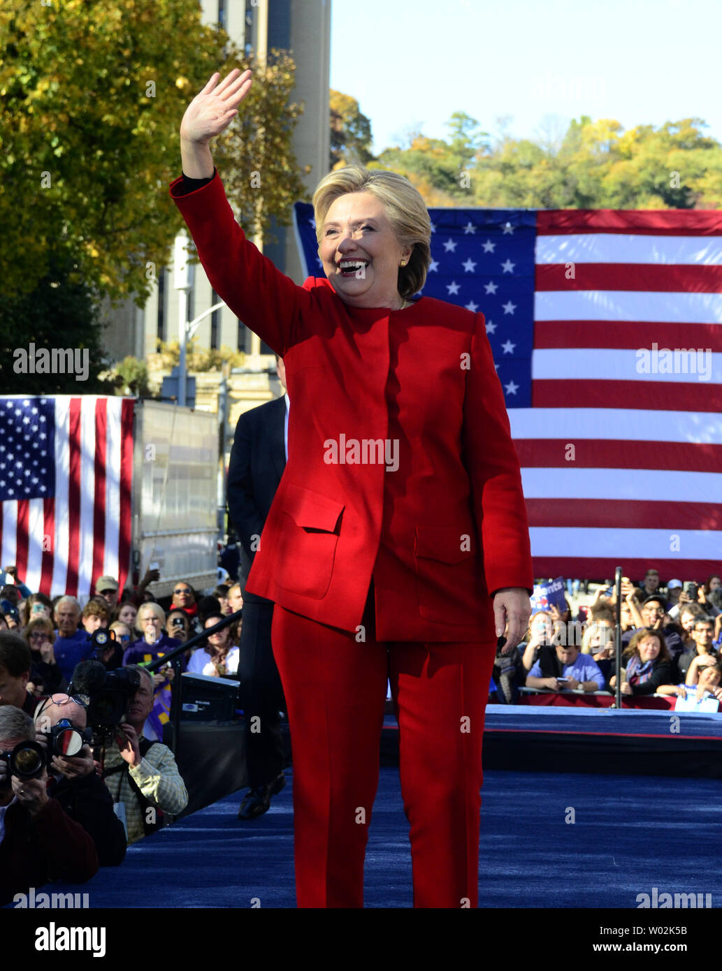 Democratic presidential candidate Hillary Clinton waves to supporters ...