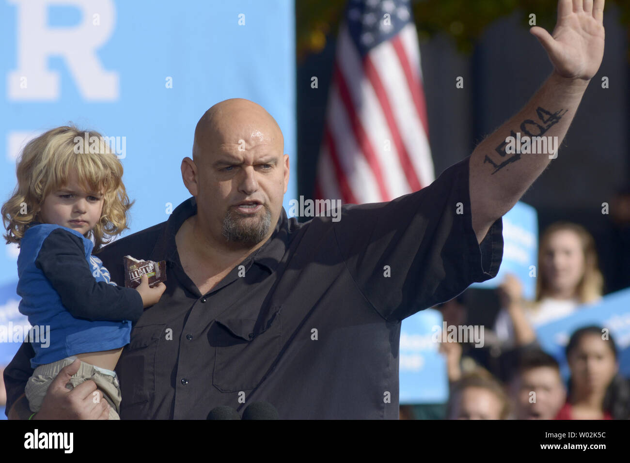 Mayor of Braddock Pennsylvania John Fetterman and his son August waves ...