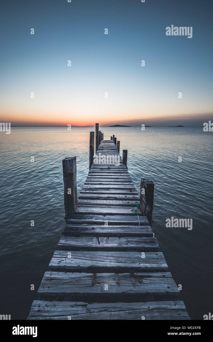 No one's in the waters. Tourists, abandoned buildings, beach, wooden ...