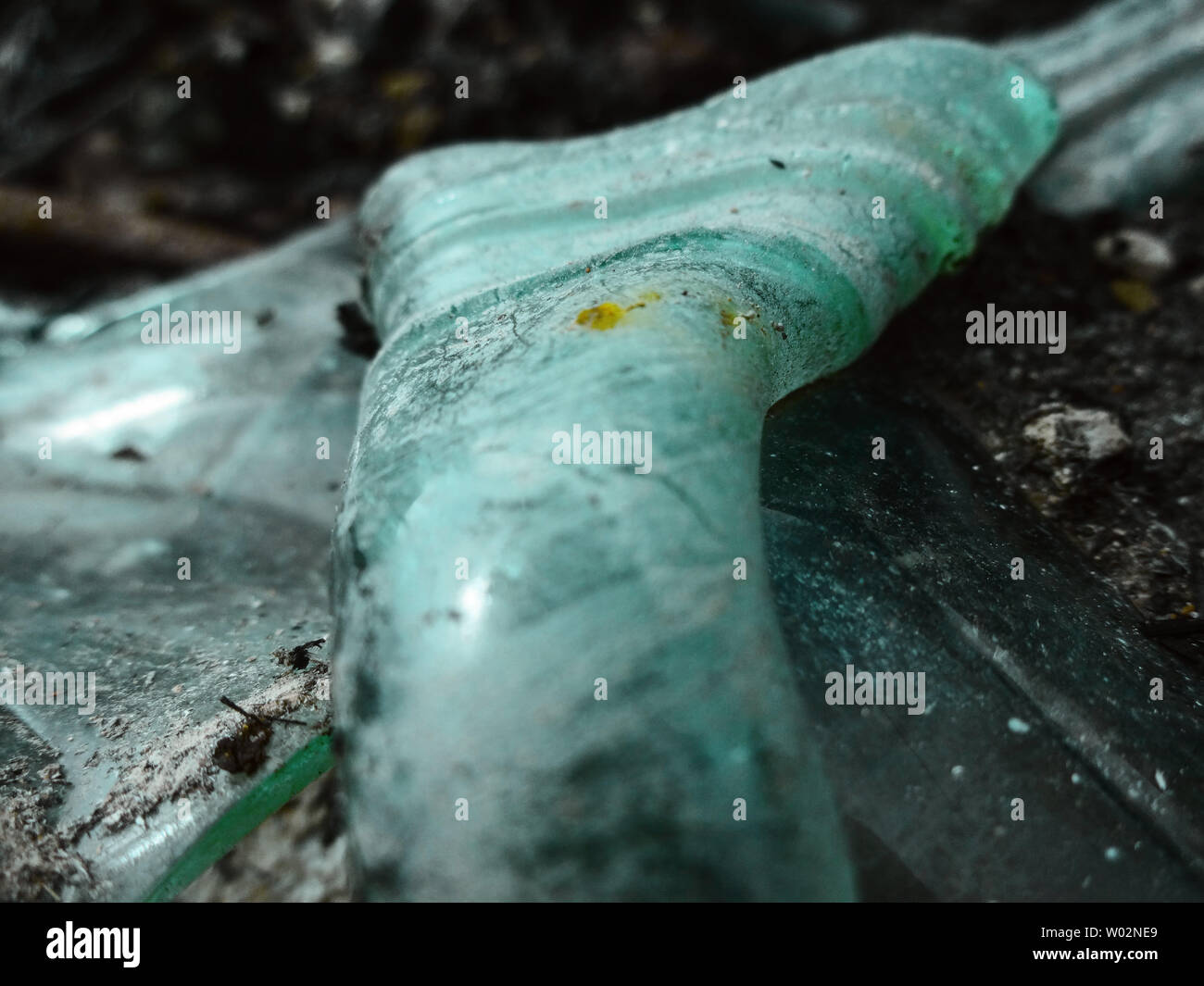 Burned, melted glass cans Stock Photo - Alamy