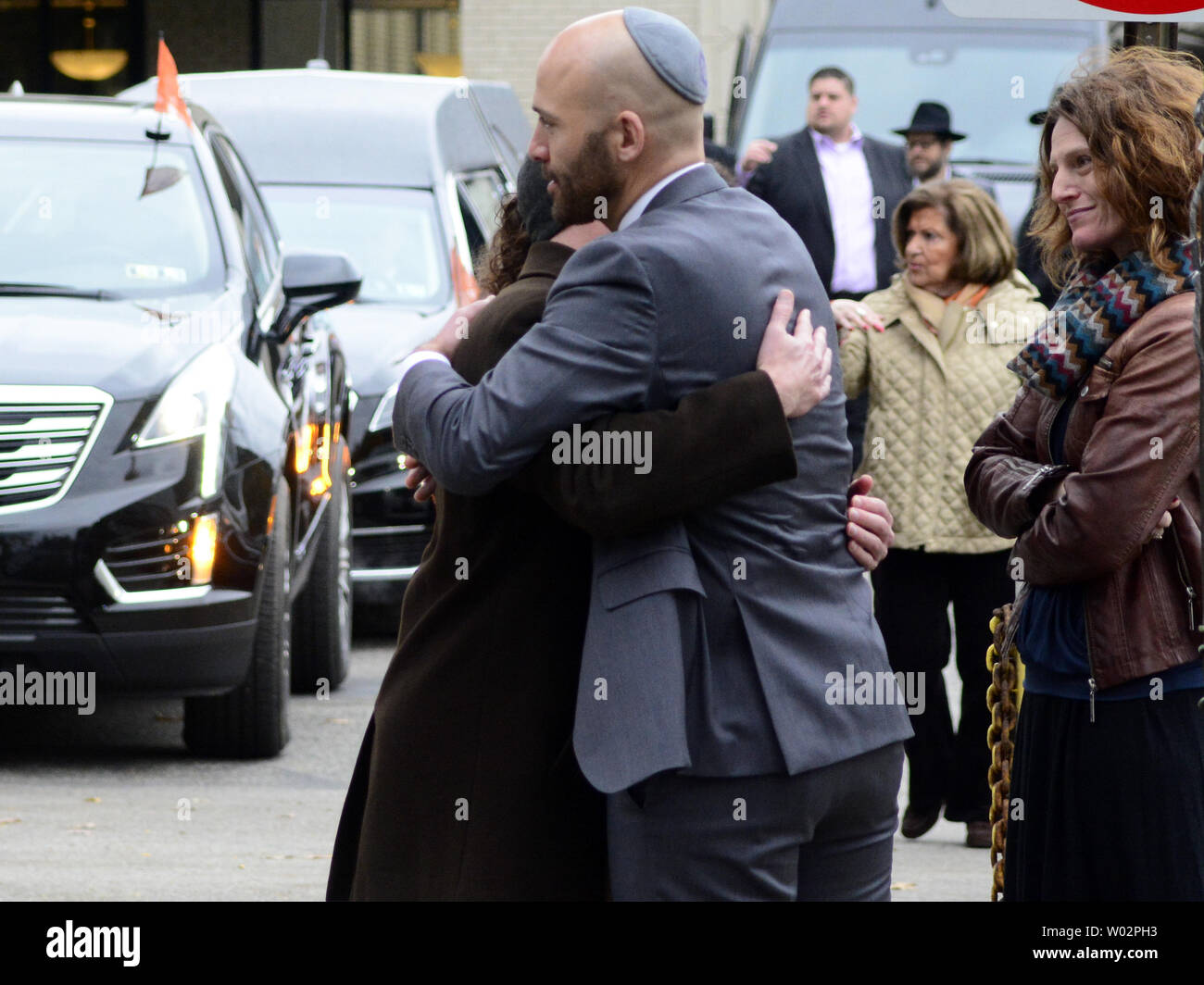 Mourners for Rose Mallinger, age 97 embraces at the Rodef Shalom Temple ...