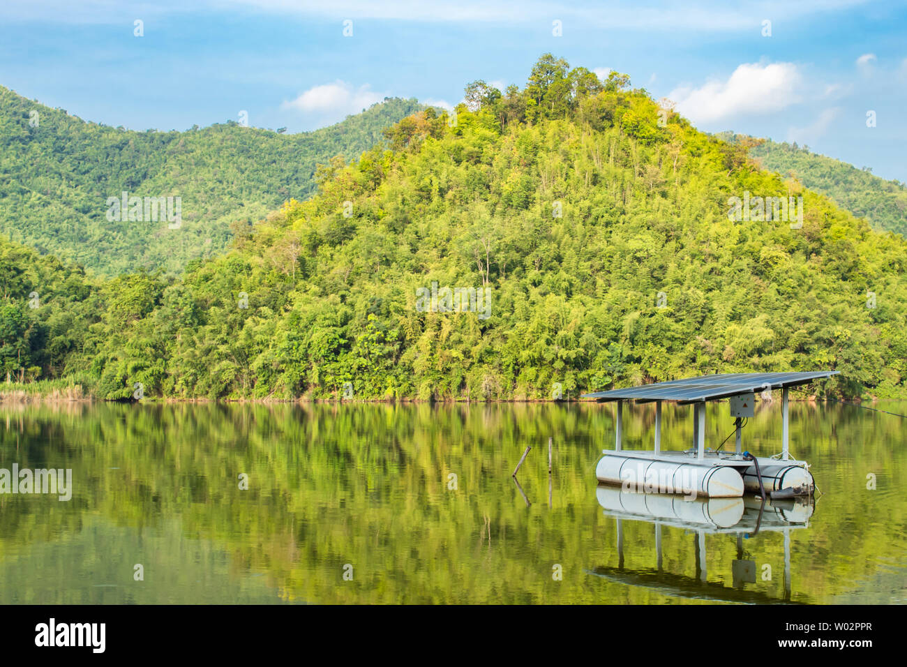 Solar cells floating in the water reservoirs and mountain views Stock ...