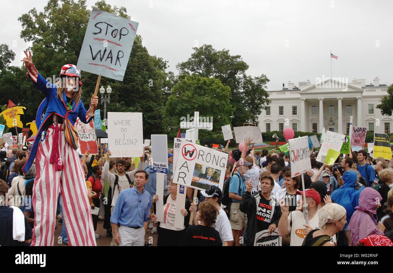 Uncle Sam on stilts and a Pinocchio nose walks in a massive anti-war ...