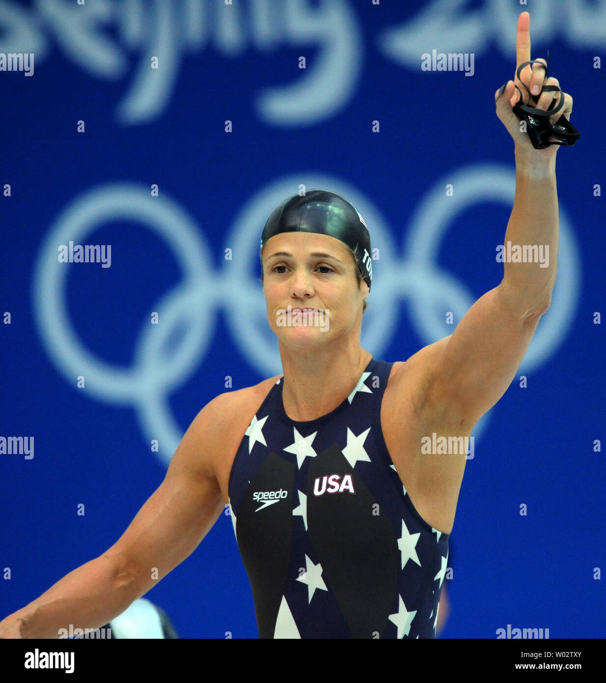 USA's Dara Torres, age 41, gets the attention of a swimming official as ...