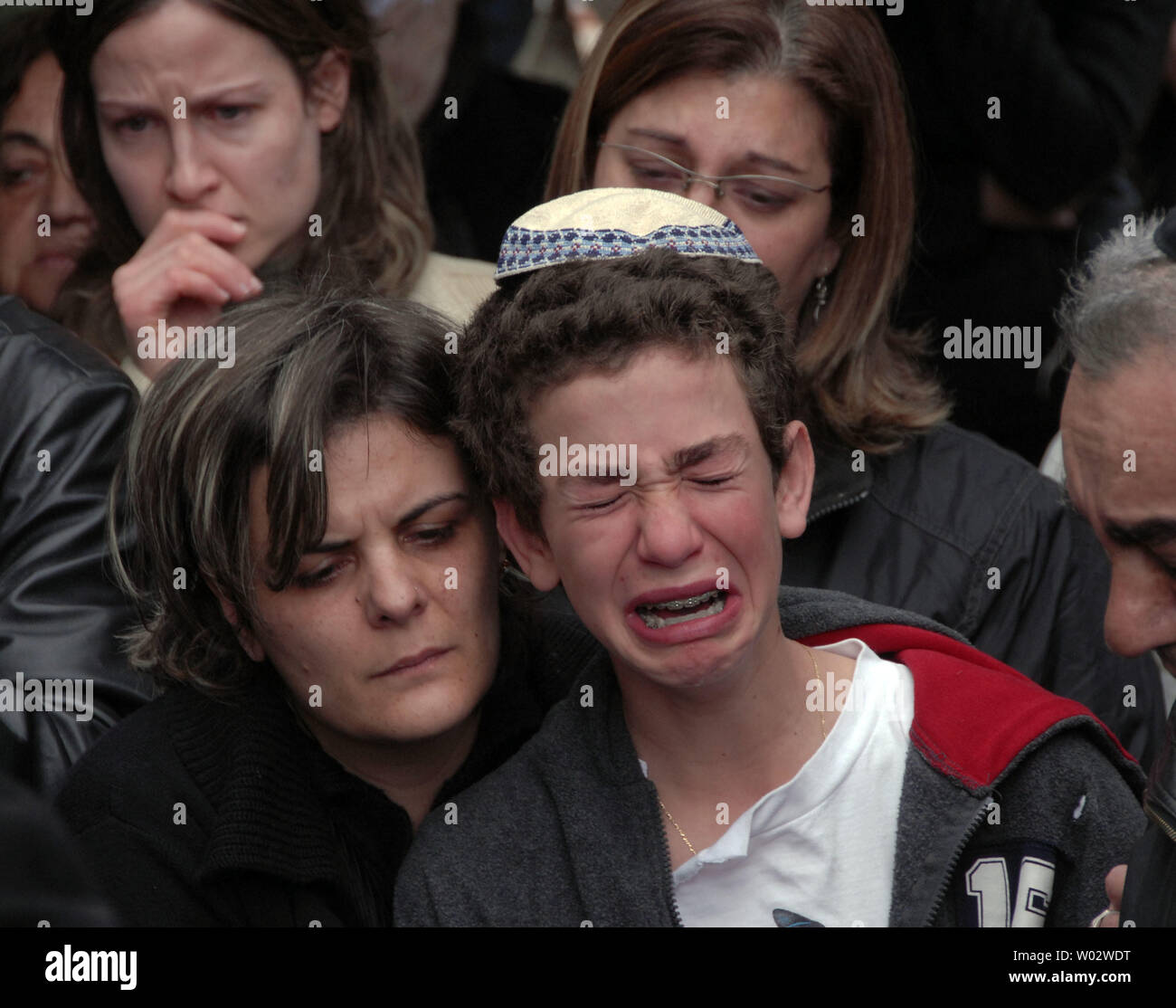The brother of Staff Sergeant Eran Dan-Gur, 20, cries at his funeral at ...