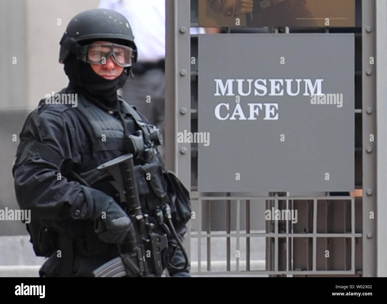 A S.W.A.T. police officer stands outside of an entrance for the U.S ...