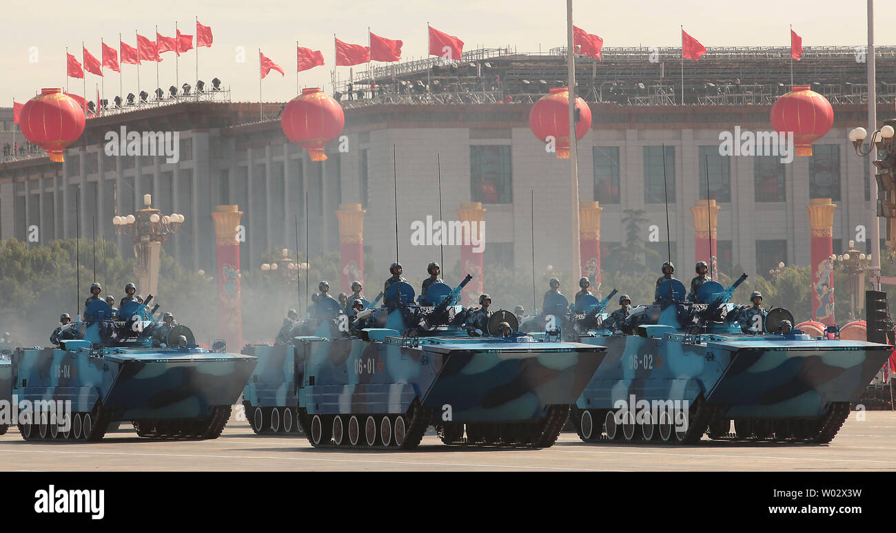 Chinese soldiers participate in a massive military parade celebrating ...