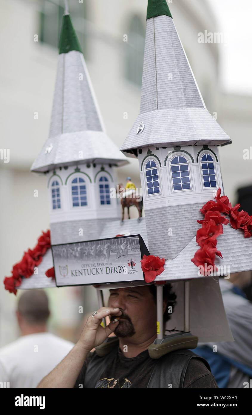 A spectator head to the infield of Churchill Downs before the 135th ...