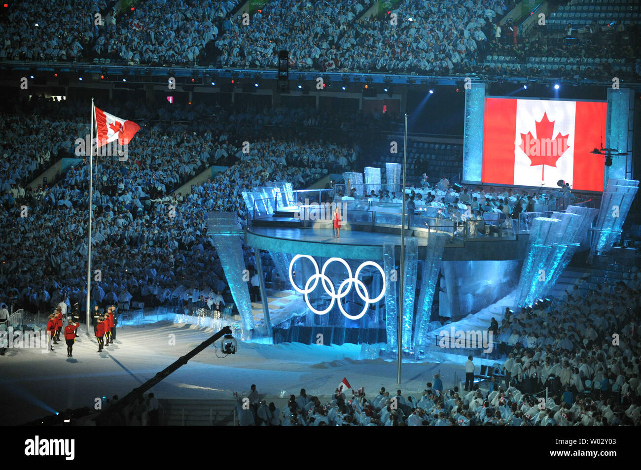 The Canadian flag is raised during the opening ceremony for the 2010 ...